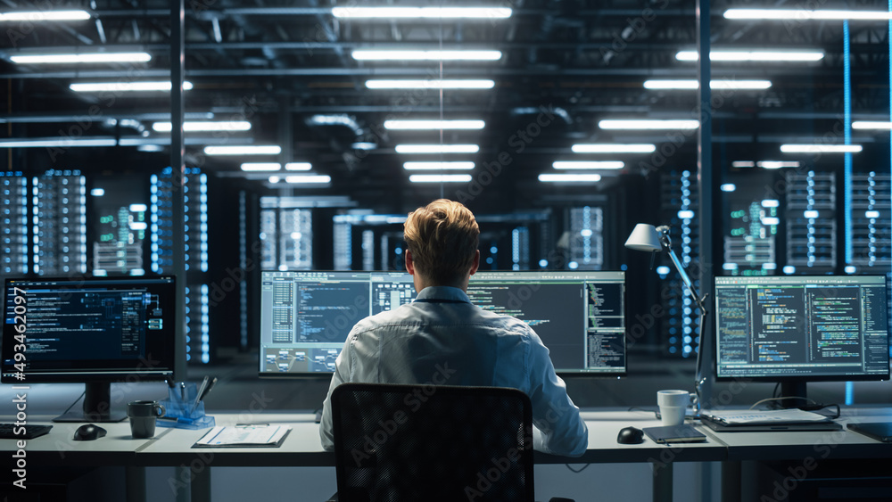 In the System Control Room Technical Operator Sits and Monitors Various Activities Showing on ...