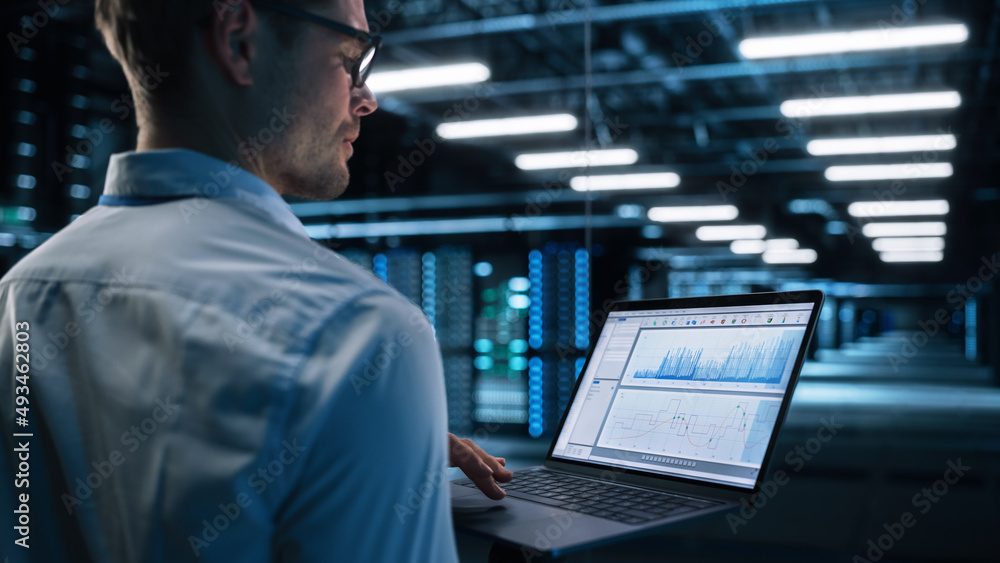 View Over the Shoulder of Caucasian Data Center IT Technician Standing ...