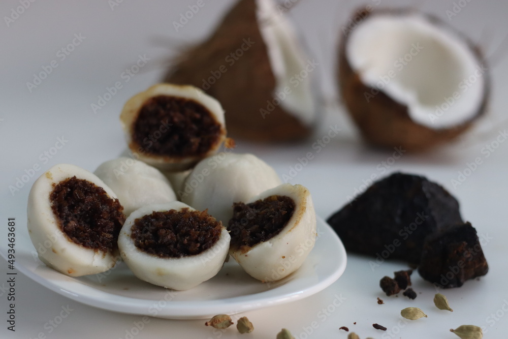 Steamed rice dumpling with a filling of palm jaggery and freshly grated ...