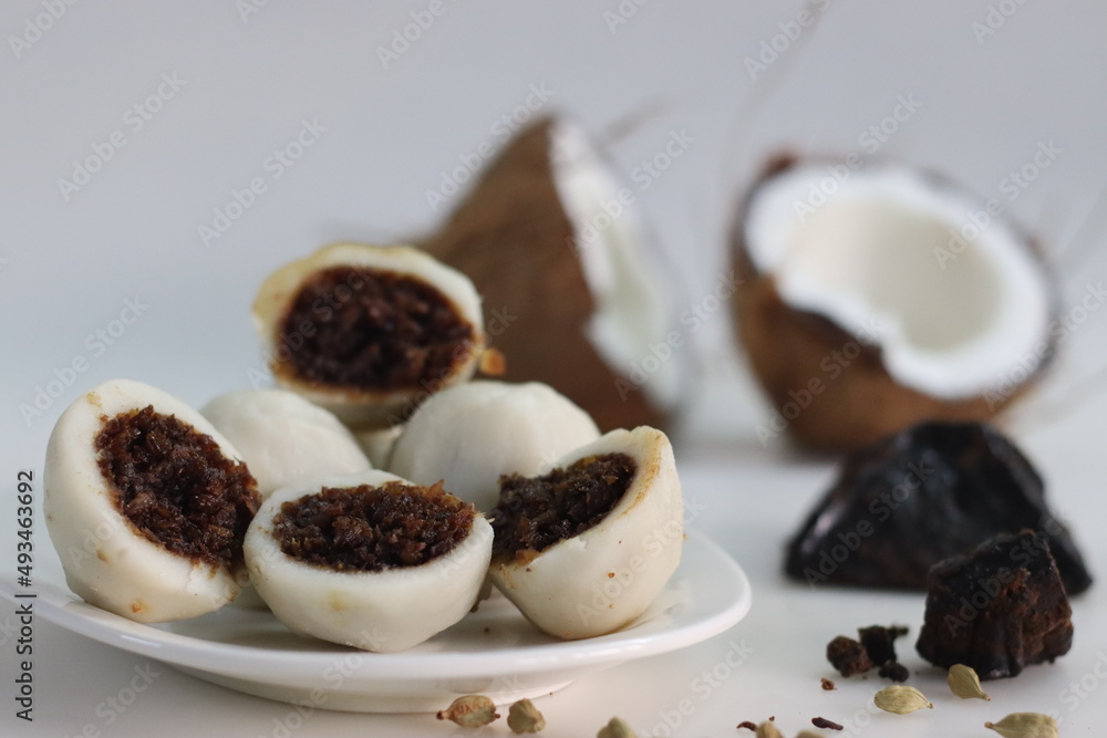 Steamed rice dumpling with a filling of palm jaggery and freshly grated ...