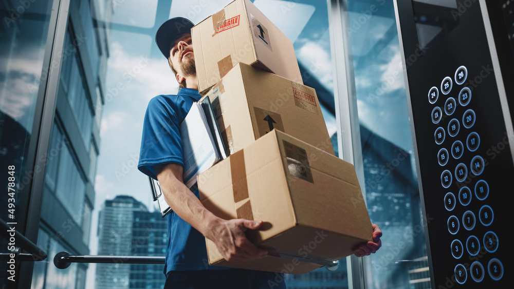 Young Delivery Person Riding Glass Elevator in Modern Office Building ...
