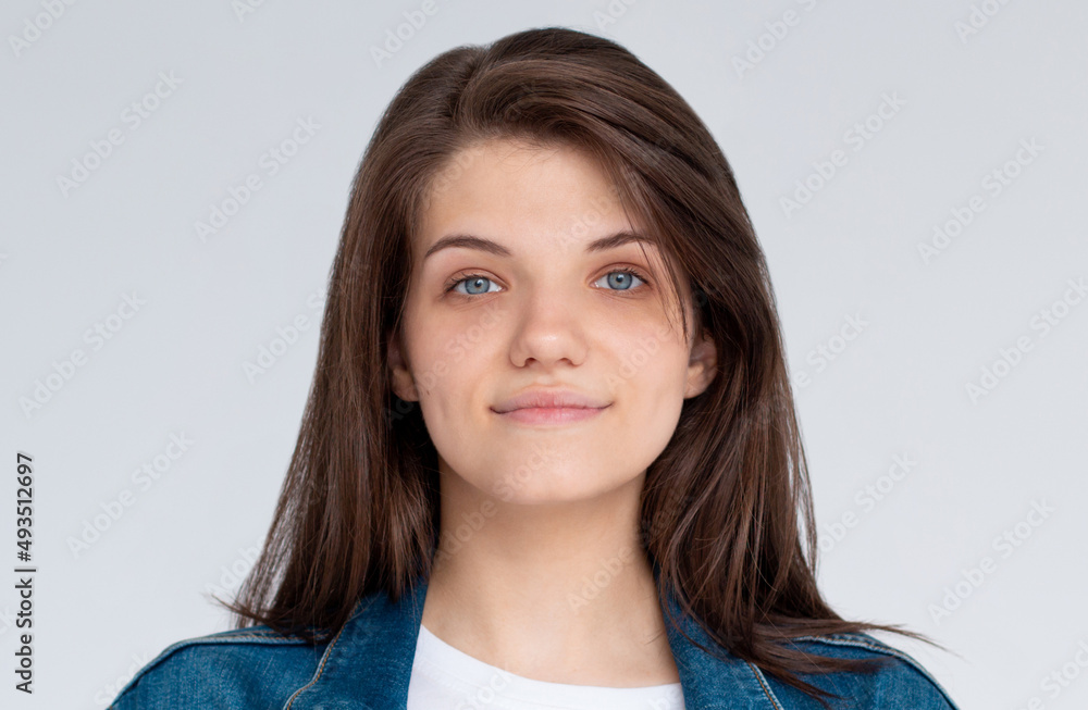 Pretty smiling joyfully female with dark hair, dressed casually ...
