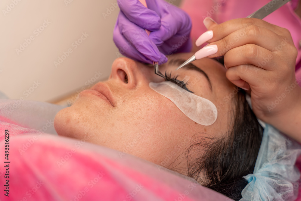 Eyelash extension procedure. Woman eye with long eyelashes. lashes ...