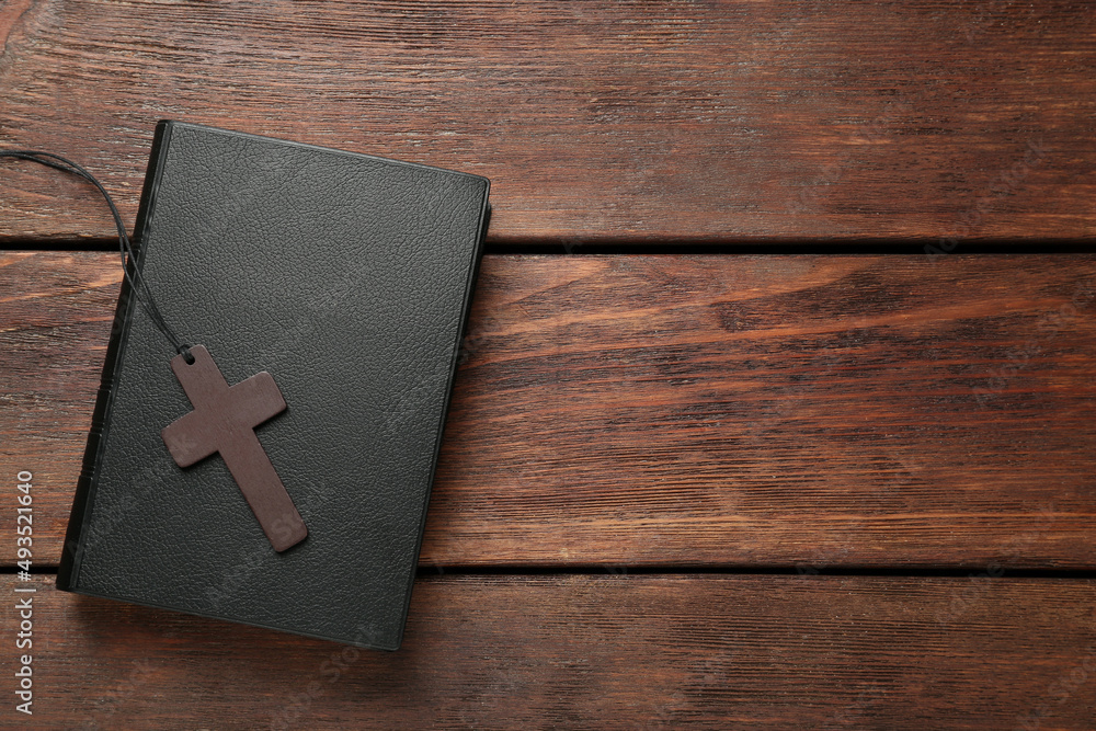 Poster Wooden Christian cross and Bible on table, top view – Wall Art ...