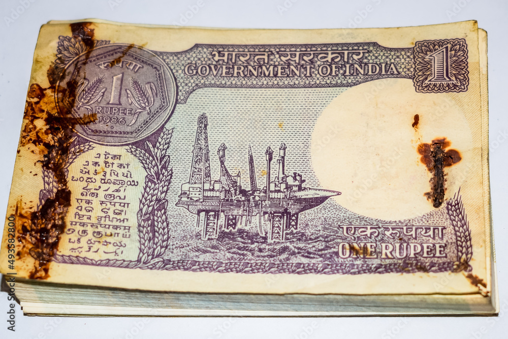 Old One Rupee notes combined on the table, India money on the rotating ...
