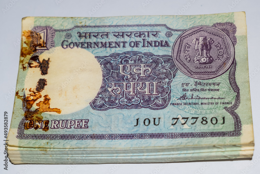 Old One Rupee notes combined on the table, India money on the rotating ...