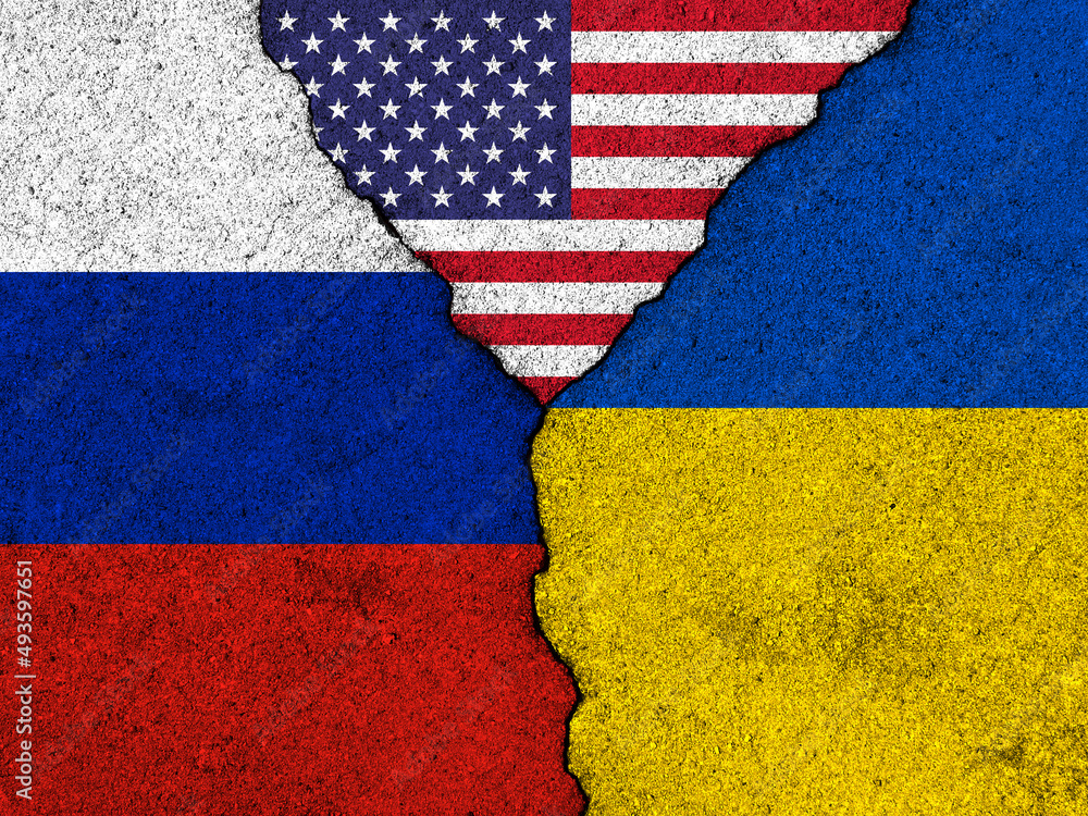 USA, Russia and Ukraine conflict concept. Flags on cracked wall ...