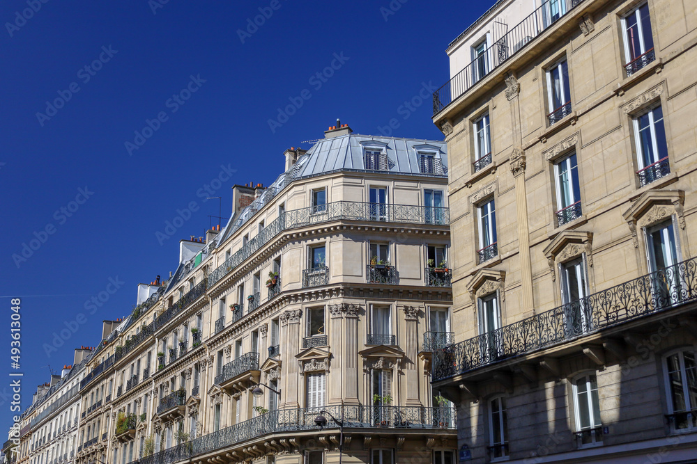 typical french haussmann building facade in Paris , old architecture ...