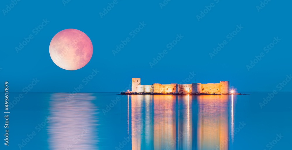 Super bloody red moon and lunar eclipse over The Maiden's Castle at ...