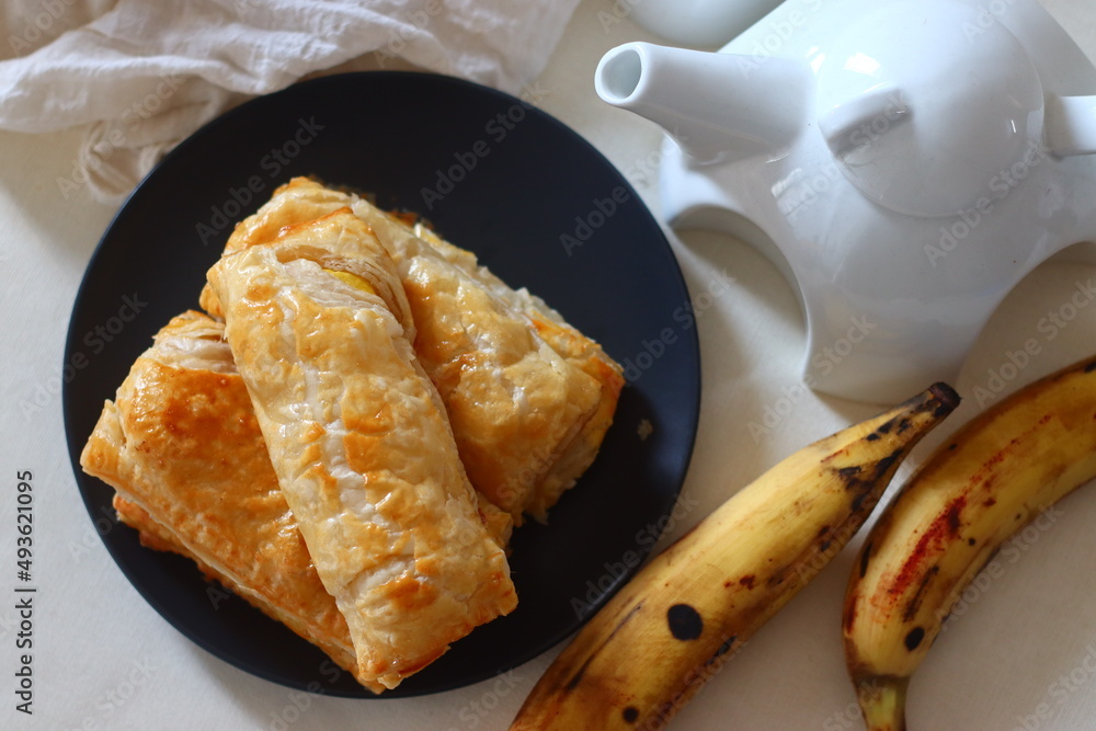 Plantain puff. Ripe plantain slices wrapped in a puff pastry sheets and ...