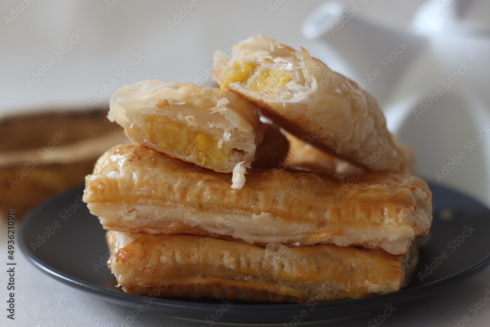 Plantain puff. Ripe plantain slices wrapped in a puff pastry sheets and ...