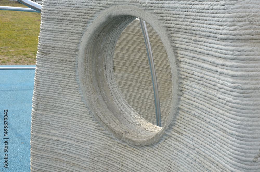 serrated, rough surface of concrete walls with twisted railings Parkour ...