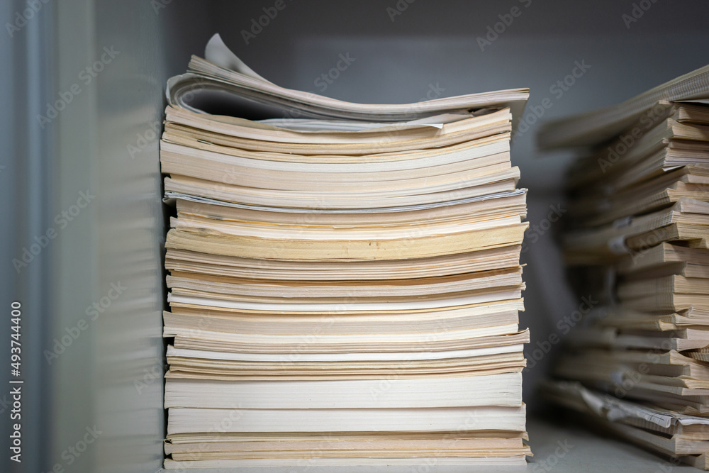 Pile of old paperwork which is kept at the document shelf. Education ...