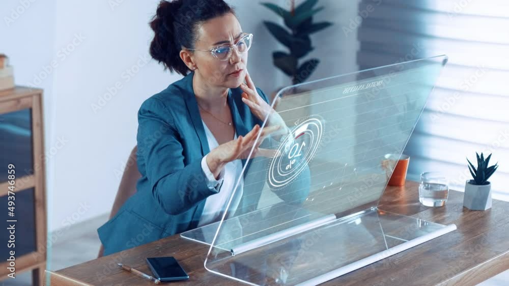 Busines adult woman using transparent display showing data analytic ...