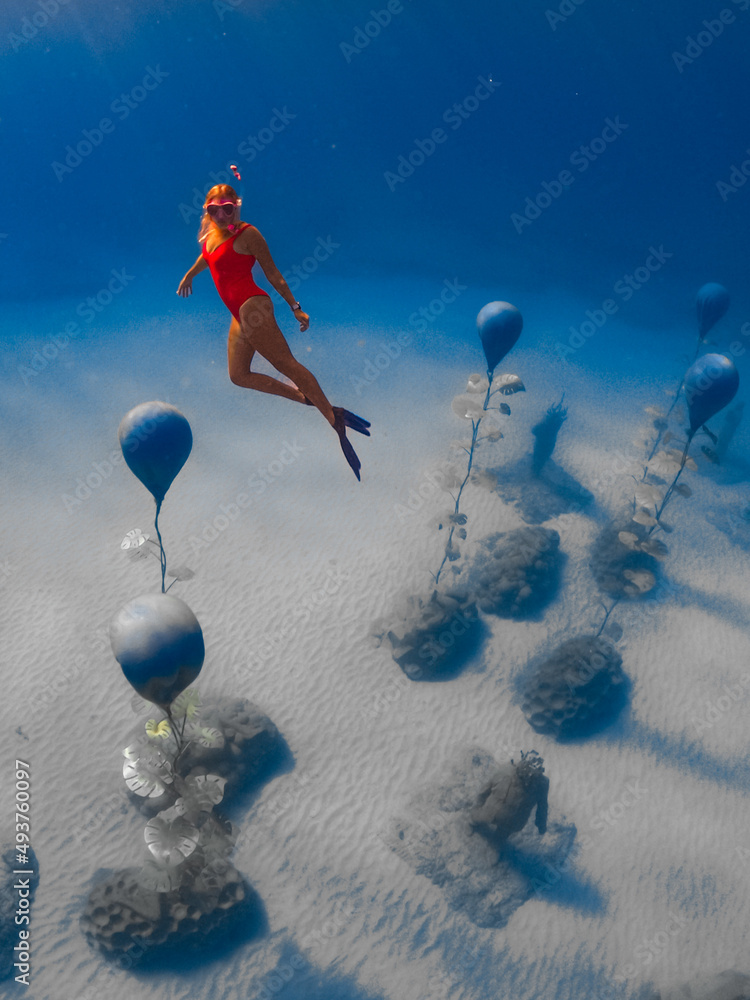 Free diver woman in red swimsuit, underwater with amazing sun rays and ...
