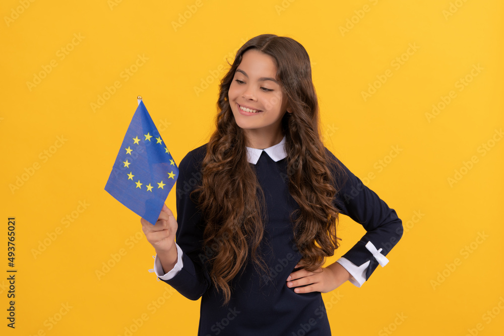 happy child look at european union flag yellow background, schengen ...