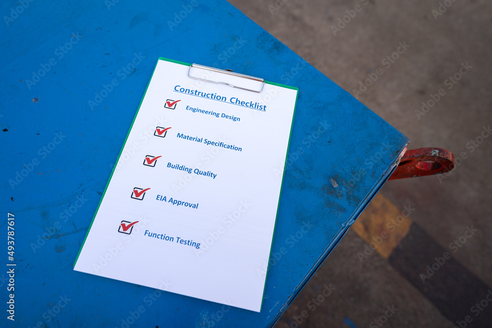 A construction checklist paperwork form with verified mark in the tick ...