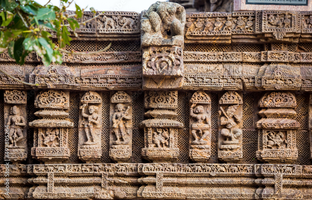 Statues of figures playing musical instruments and marching elephants ...