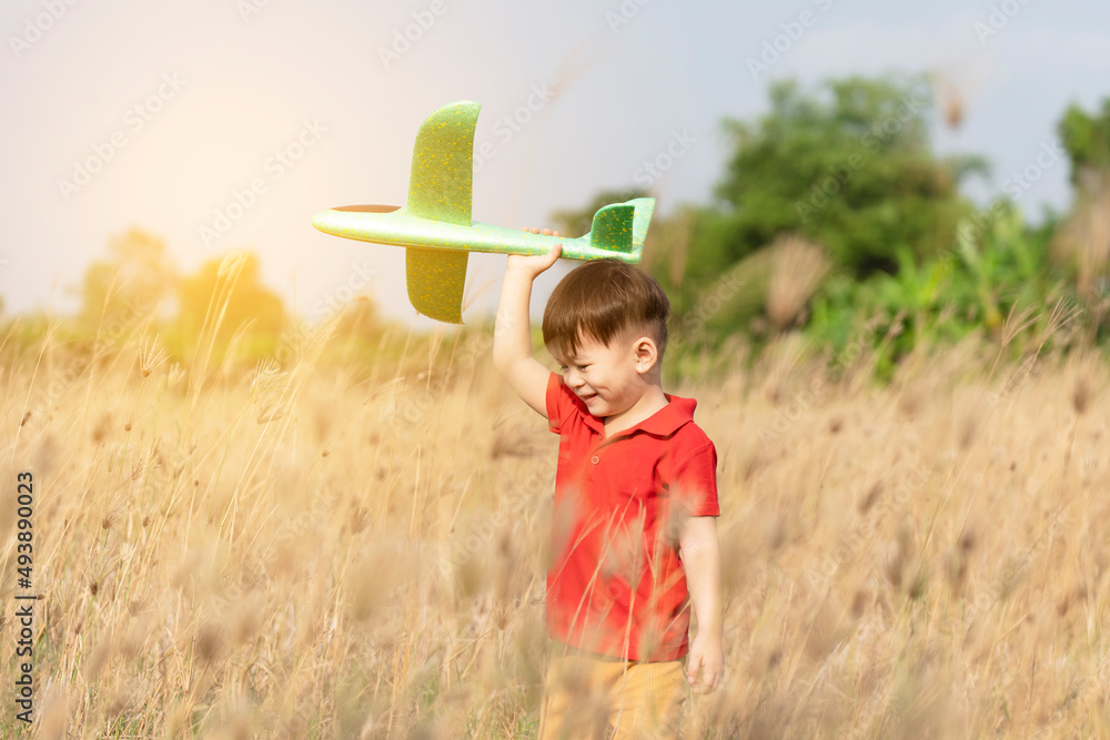 boy happy playing with toy plane in nature and clear morning sky, Child ...