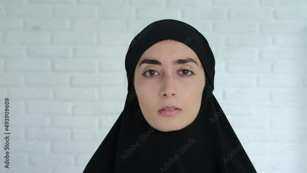 Crying Muslim woman in a black hijab violence and restriction of freedoms to women in the Middle ...