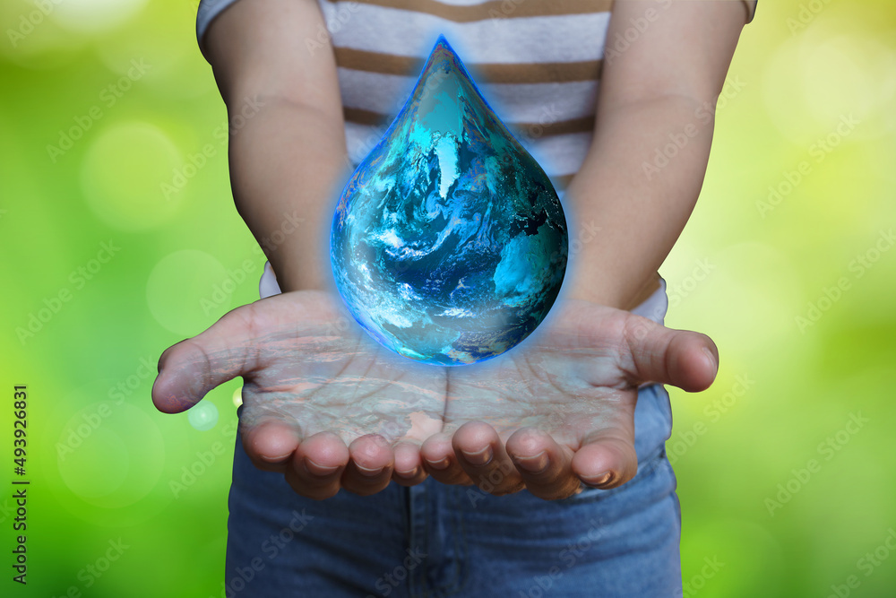 Earth fuel drop was holding in human hands. World environment day and ...