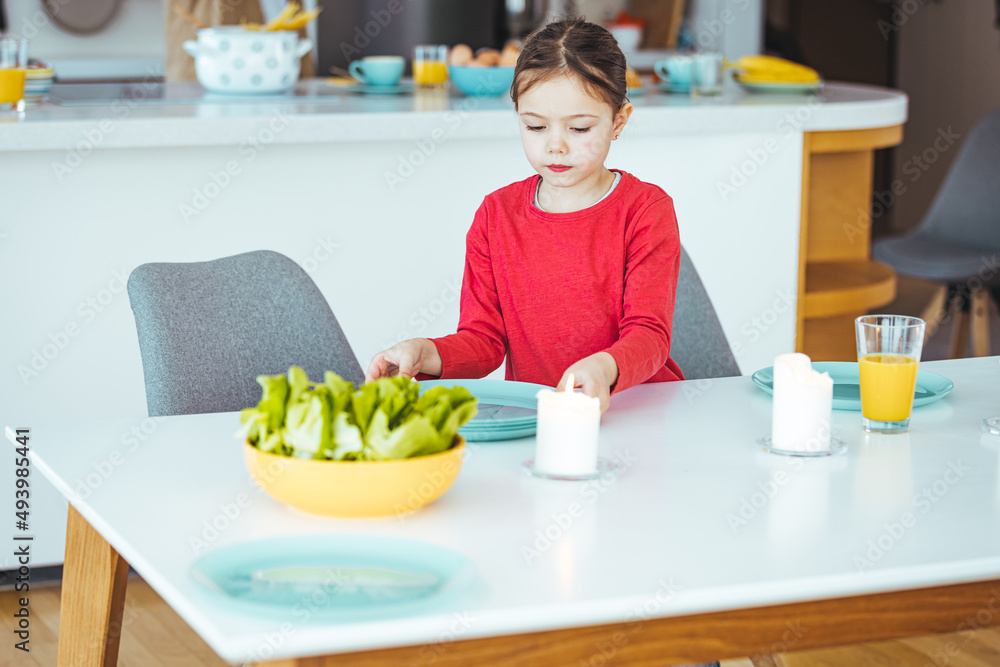 Boy Setting The Table