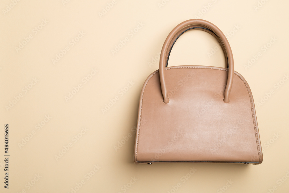 Fashionable woman bag on color background. Top view Stock-Foto | Adobe ...