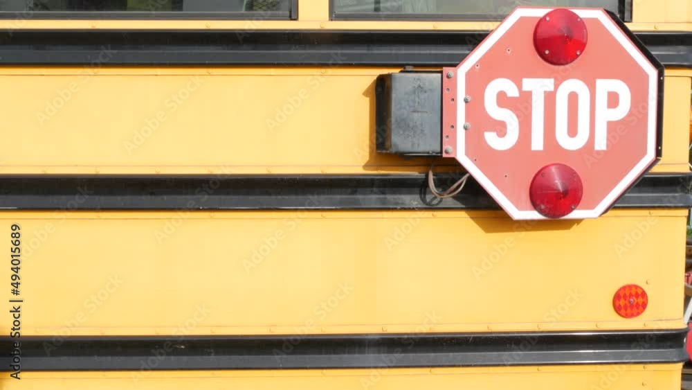 Red stop sign, yellow school bus in California, USA. Traffic warning on ...
