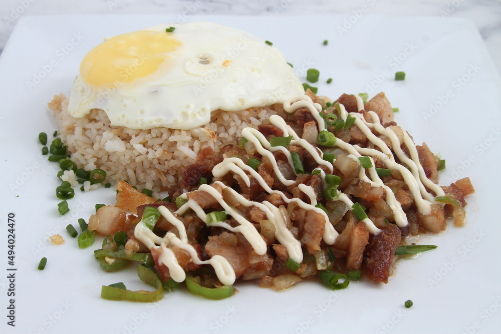Freshly cooked Filipino food called Sisig silog Stock Photo | Adobe Stock