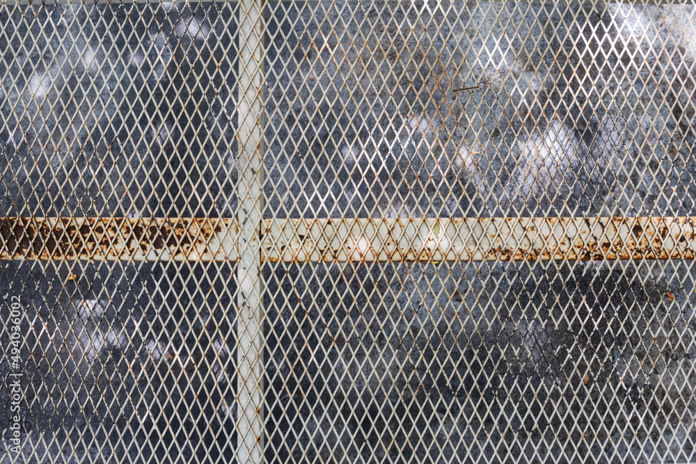 A metal grid background was used to create a high-altitude walking ...