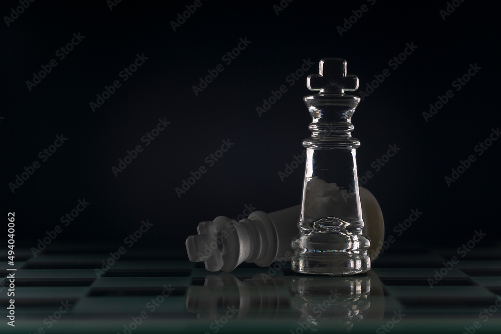 Fallen chess king as a metaphor for fall from power black background ...