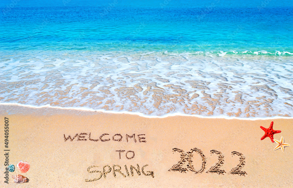 Welcome to Spring 2022 on a tropical beach Stock Photo | Adobe Stock