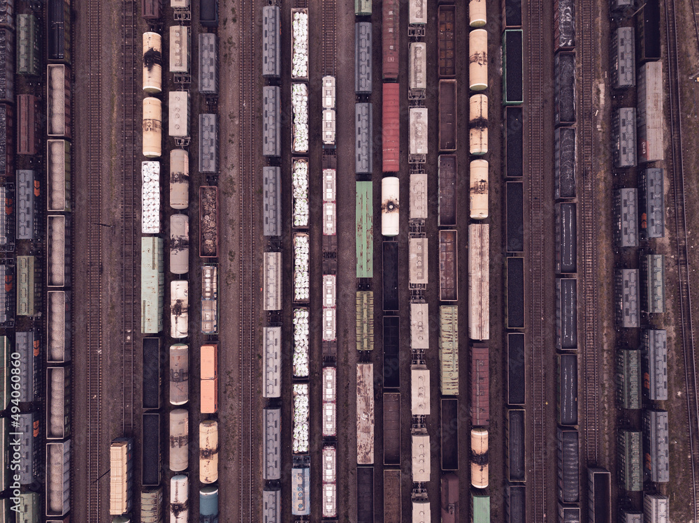Aerial view of freight trains. Railway cargo wagons with goods on ...