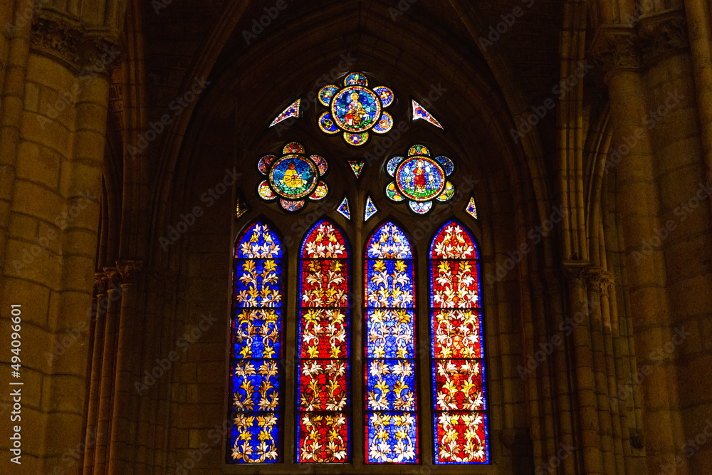 Old stone cathedral with beautiful rose windows. Stock Photo | Adobe Stock