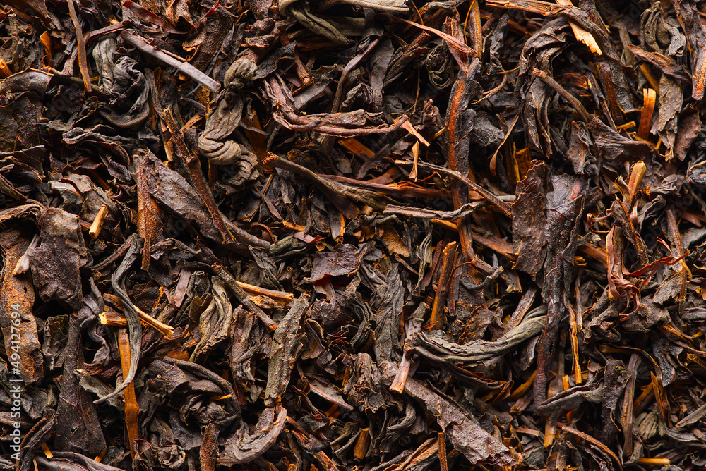 Black large-leaf tea as abstract background. Texture of dry black tea ...