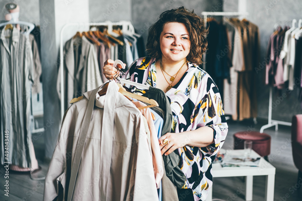 Plus Size Woman Choose Fashioned Dress in Store. Plus size women ...