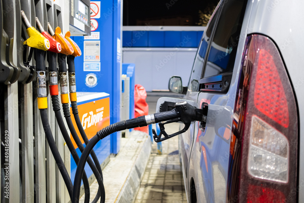 Refueling the fuel tank of a car at a Gazpromneft gas station. Stock ...