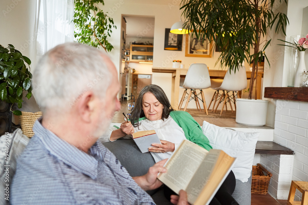 Retired senior couple reading books Stock Photo | Adobe Stock