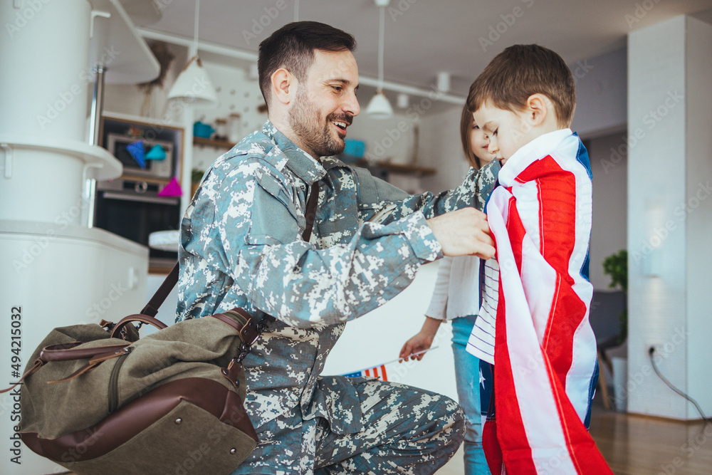 Military man father hugs son. Portrait of happy american family. A ...