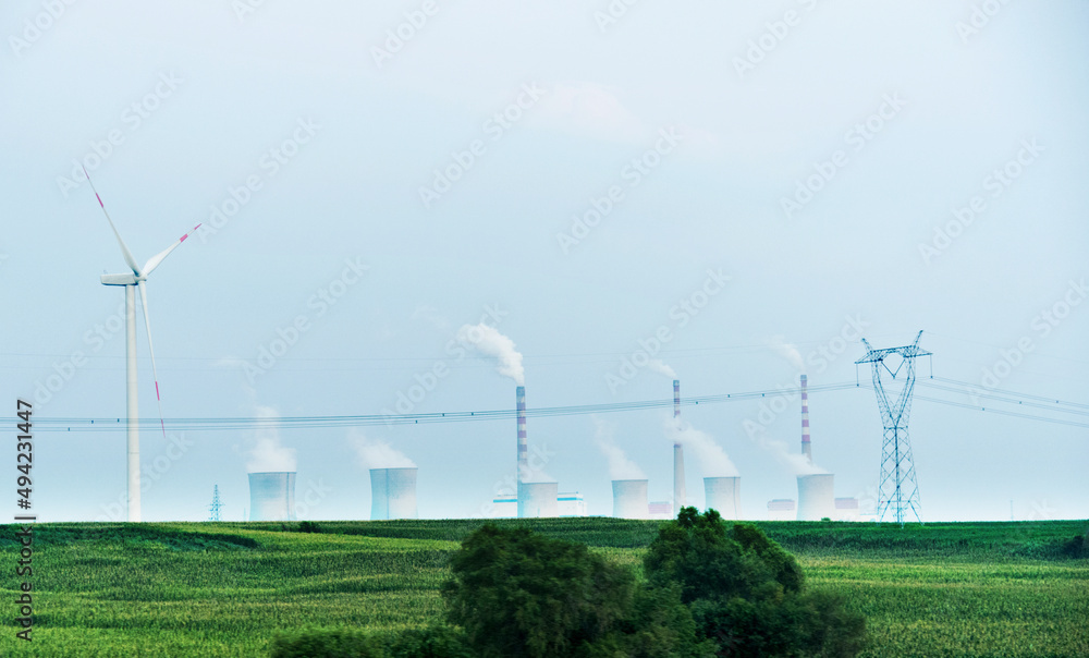Cooling towers of plant and wind power generation Stock Photo | Adobe Stock