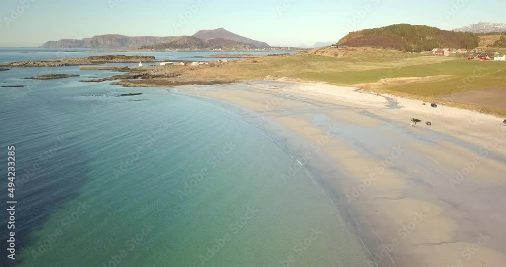 Ascending over a beautiful beach called Blimssanden on Vigra island in ...