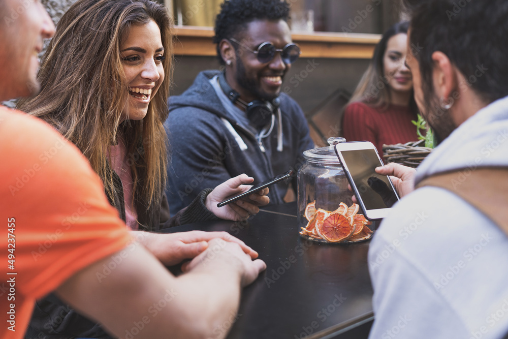 Cheerful 20s international friends get together at cafe restaurant ...
