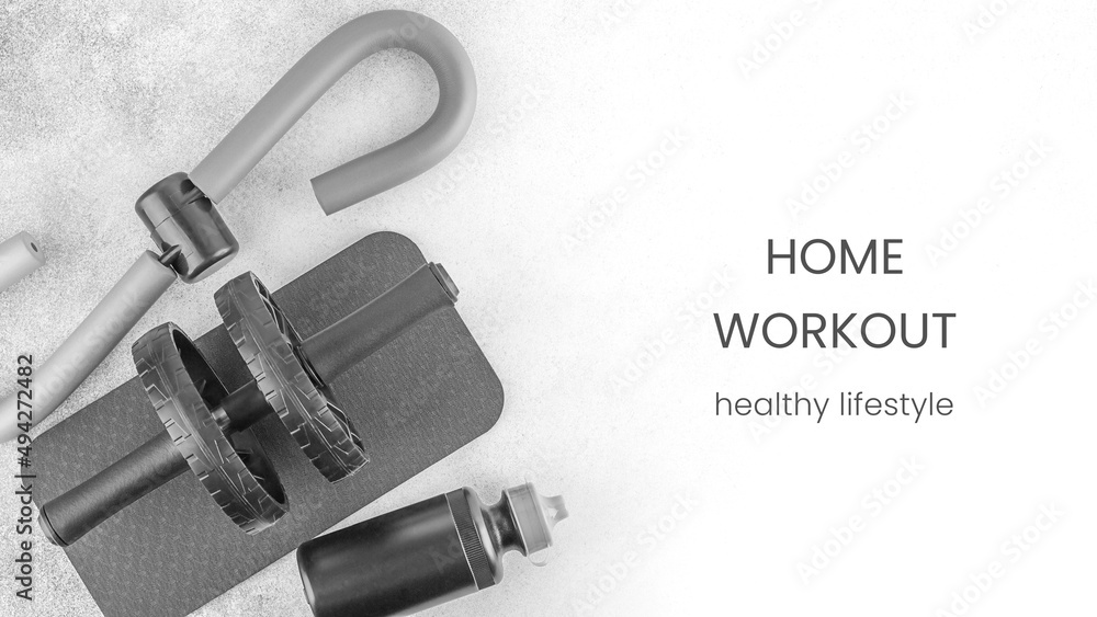 Fitness equipment on a gray concrete background with text on a white ...