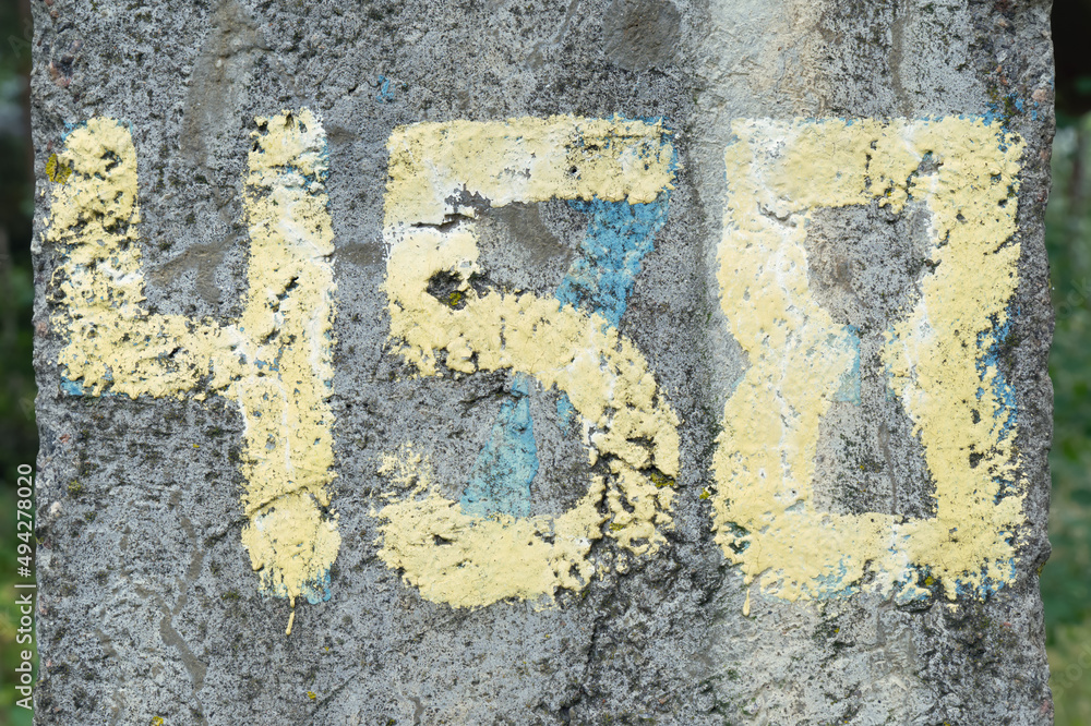 Four hundred and fifty eight number painted with yellow paint on ...