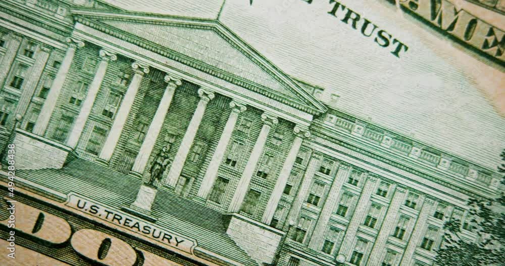 The camera moving along the back of a ten dollar bill - the US Treasury ...