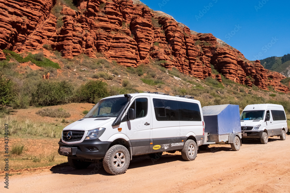 x4 off-road van mersedes-benz sprinter with red mountains on background ...