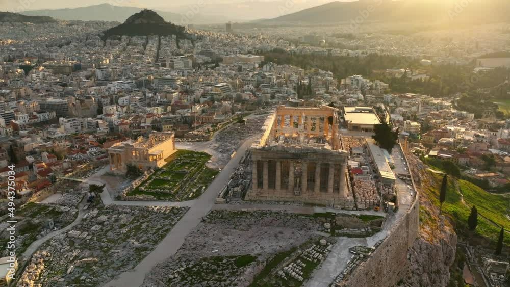 Parthenon in Athens aerial view at sunrise, flying around ancient Greek ...