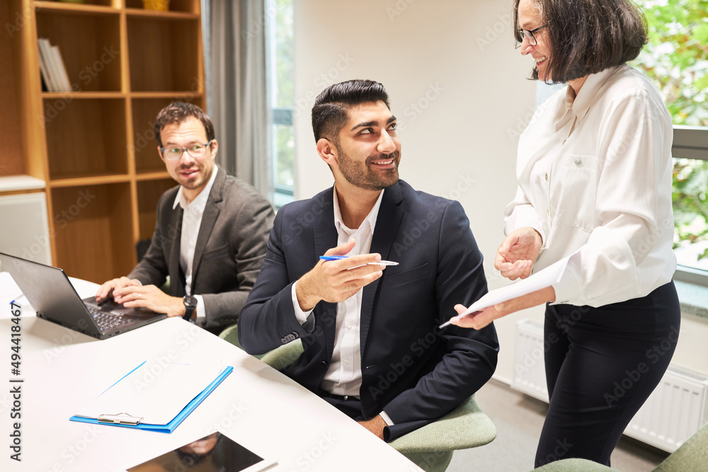 Young business trainee in training in a meeting Stock Photo | Adobe Stock