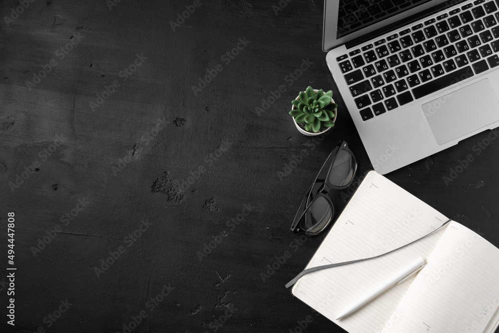 Notepad is on top of office desk table with laptop and supplies Stock ...