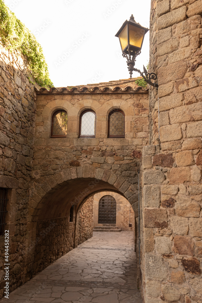 stone alley in the medieval town of pals on the costa brava Stock Photo ...